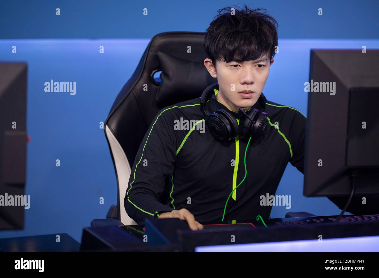 Young Chinese man playing esports Stock Photo - Alamy