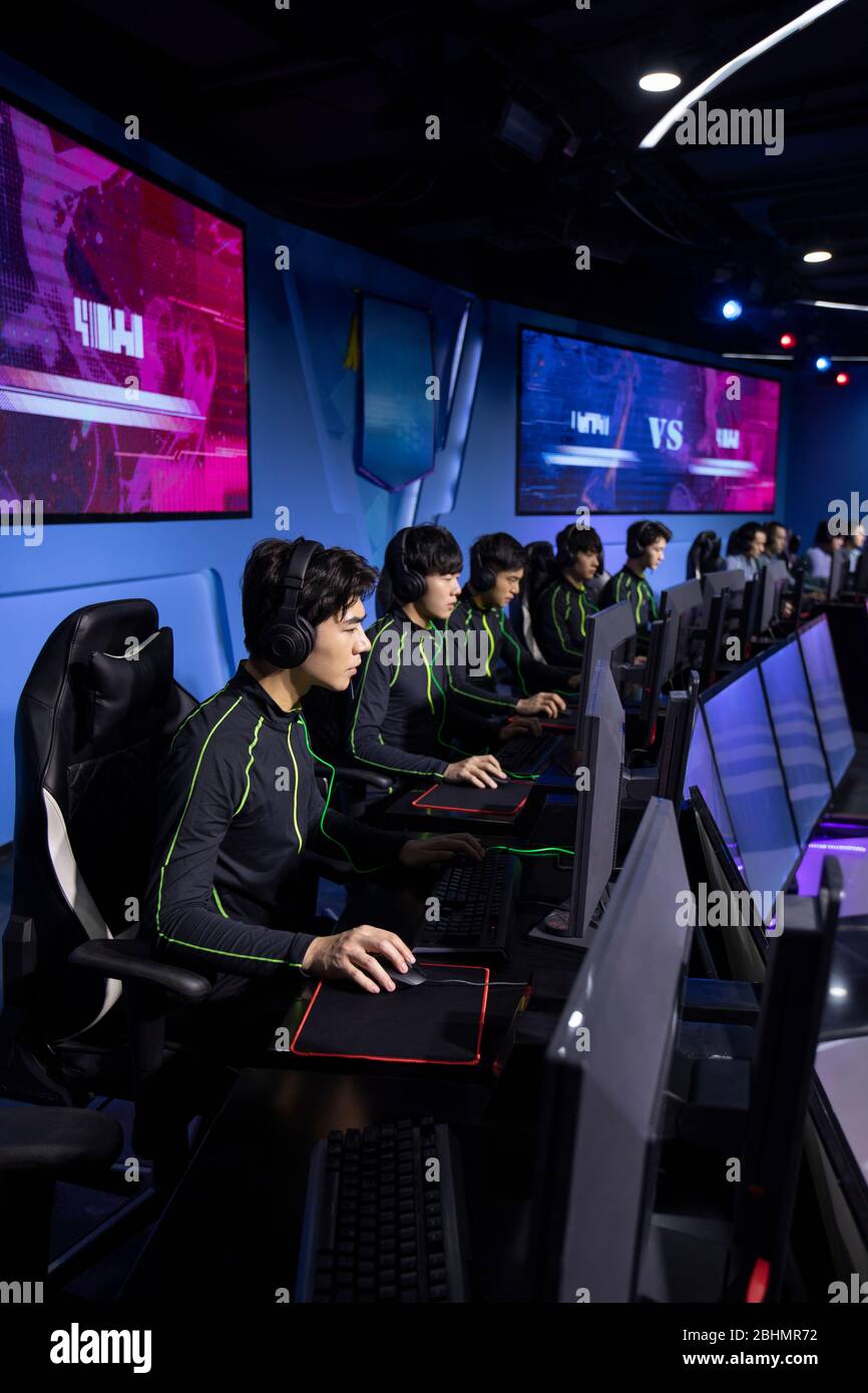 Young Chinese men playing esports Stock Photo - Alamy