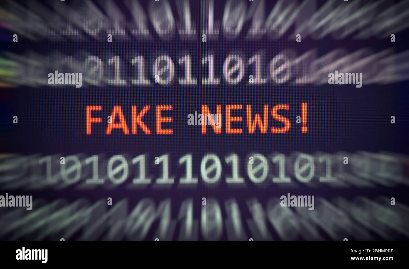FAKE NEWS message on display screen black background technology alert ...