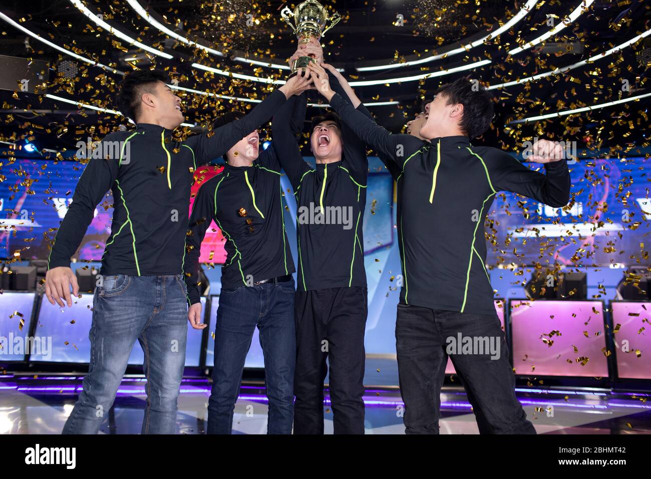 Young Chinese men winning esports competition Stock Photo - Alamy