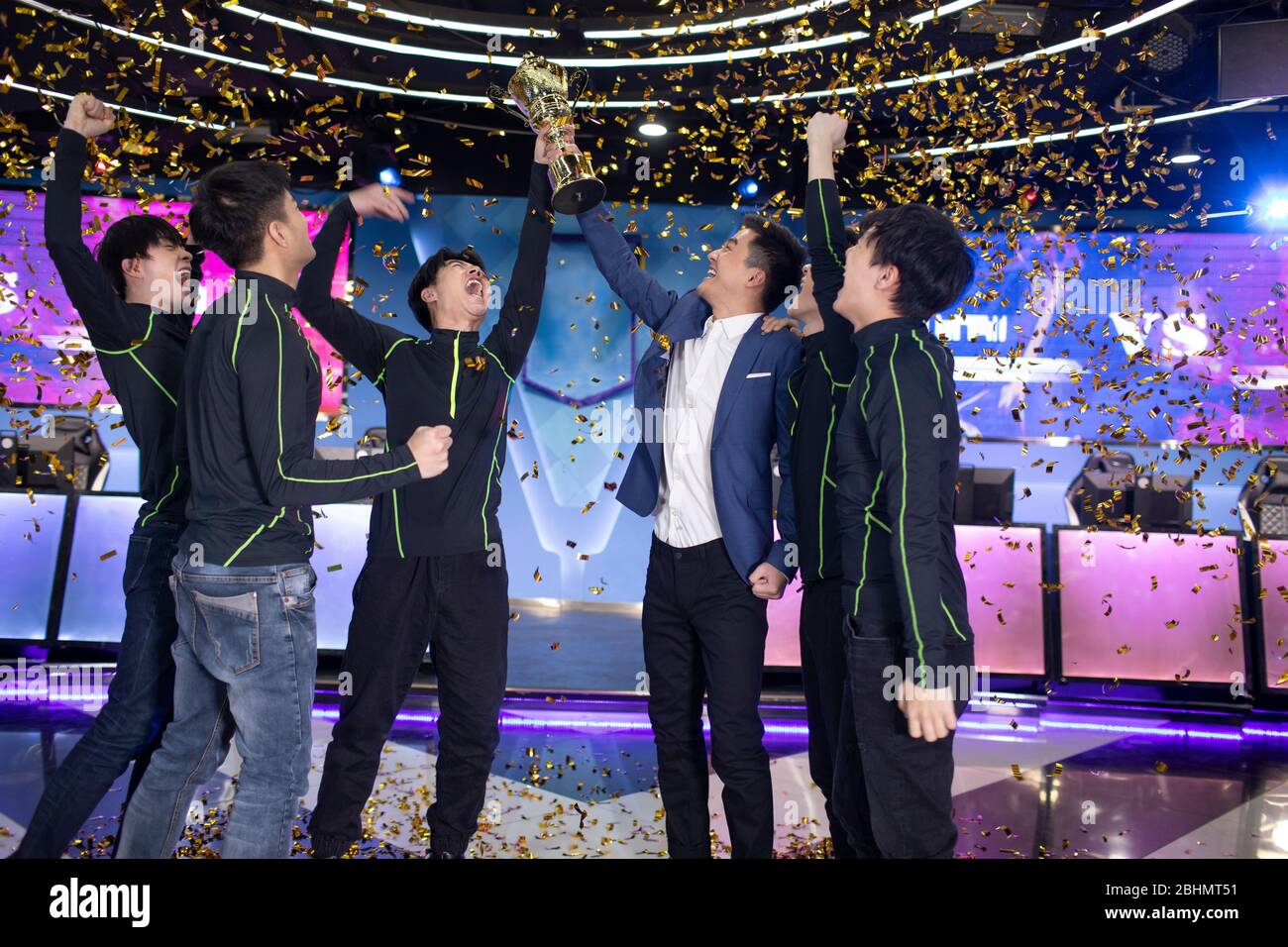 Young Chinese men winning esports competition Stock Photo - Alamy