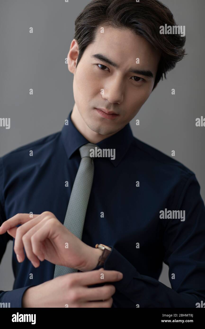 Portrait of young Chinese businessman Stock Photo - Alamy