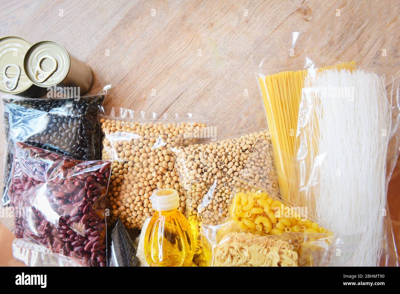Donations food with canned food on wooden table background / pasta ...