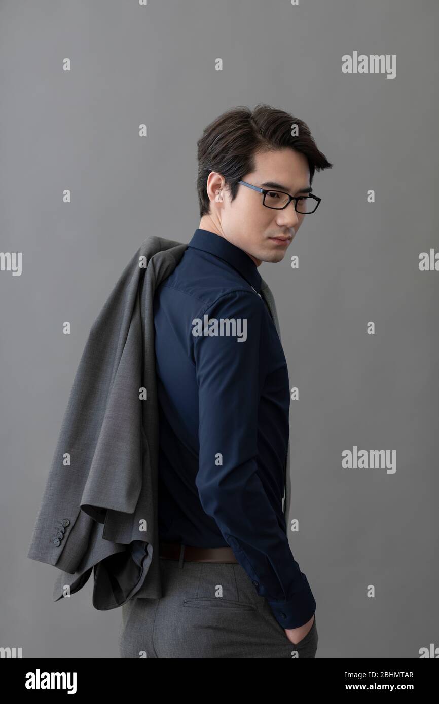 Portrait of young Chinese businessman Stock Photo - Alamy