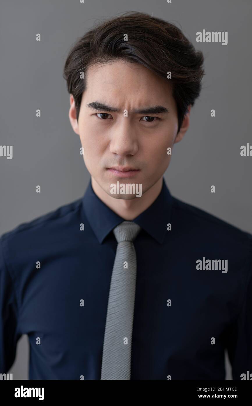 Portrait of young Chinese businessman Stock Photo - Alamy
