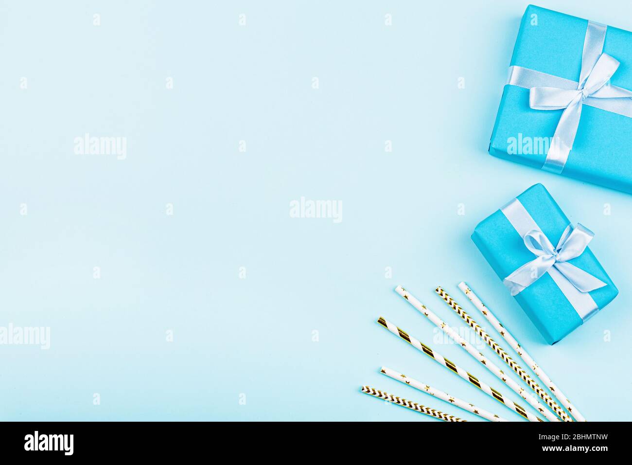 Happy Birthday or Fathers Day background with gifts and paper straws on ...