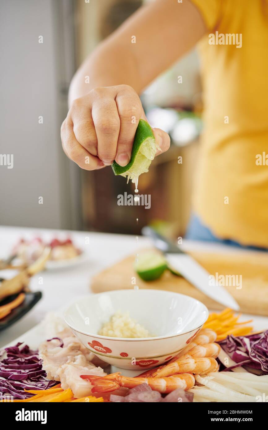 Close up squeezing lime salad hi-res stock photography and images - Alamy
