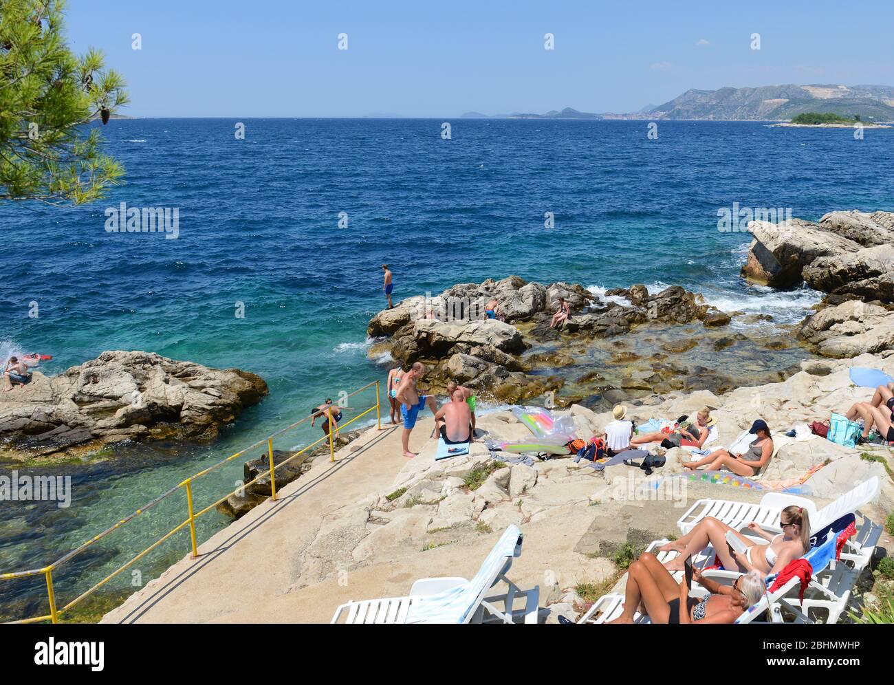 Tourist soaking the sun in Cavtat, Croatia Stock Photo - Alamy