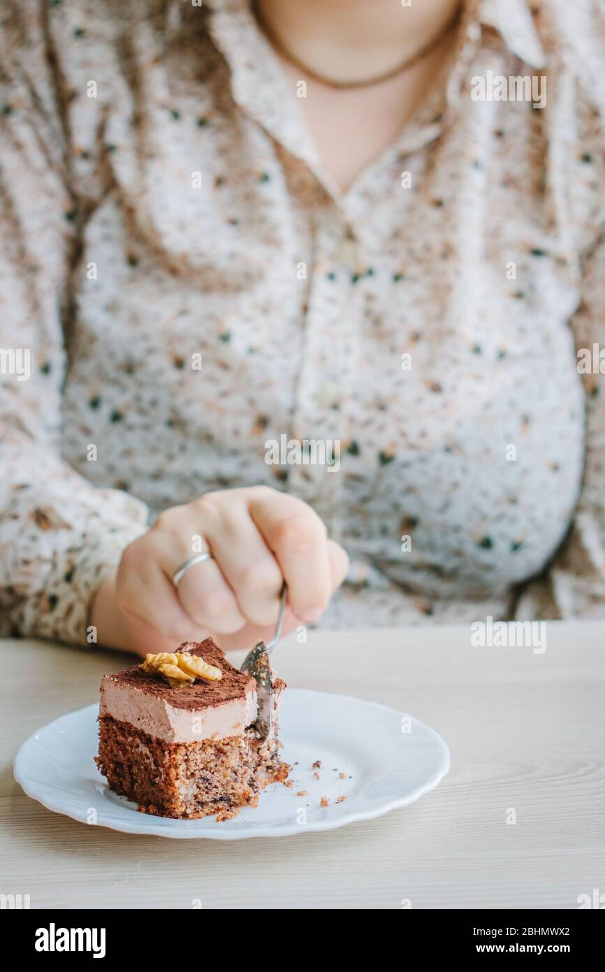 Woman eating piece chocolate cake hi-res stock photography and images ...