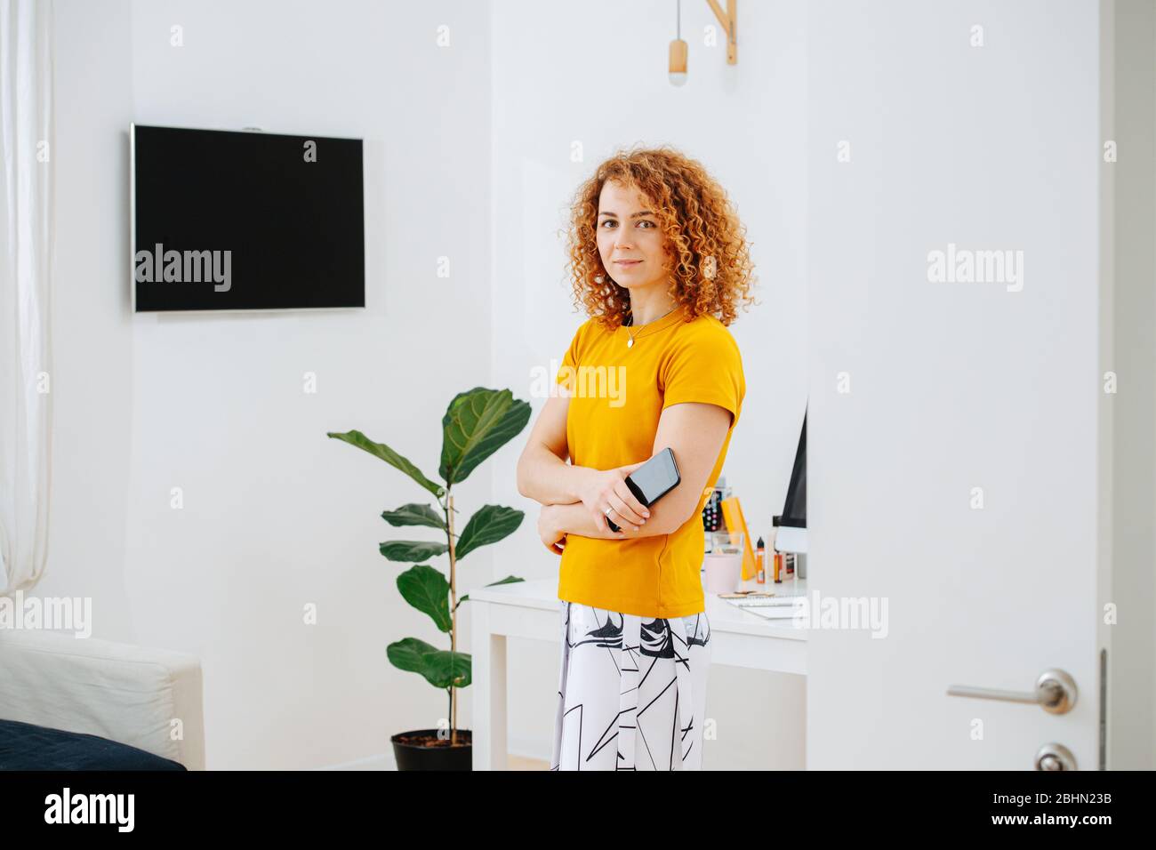 Half-length half-turned portrait of a young woman with red hair Stock ...