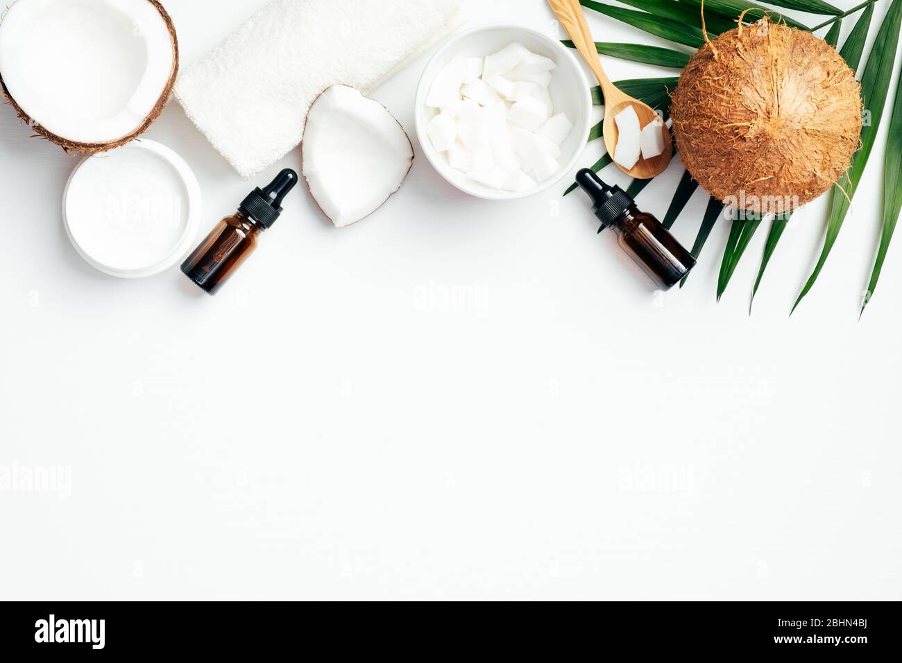 Set of natural coconut cosmetic on white background. Flat lay ...