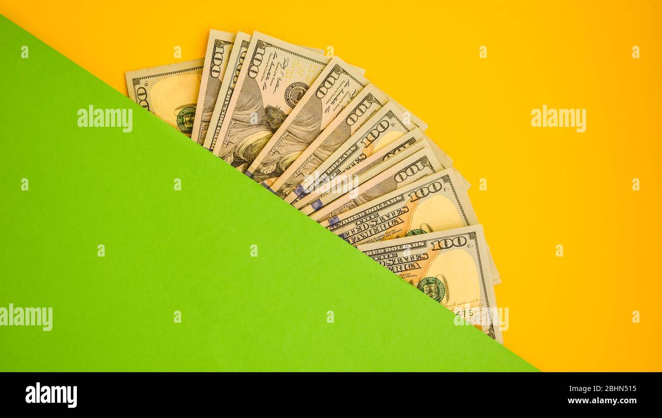 Cash Money on colorful background, Fan of 100 dollar bills on color ...