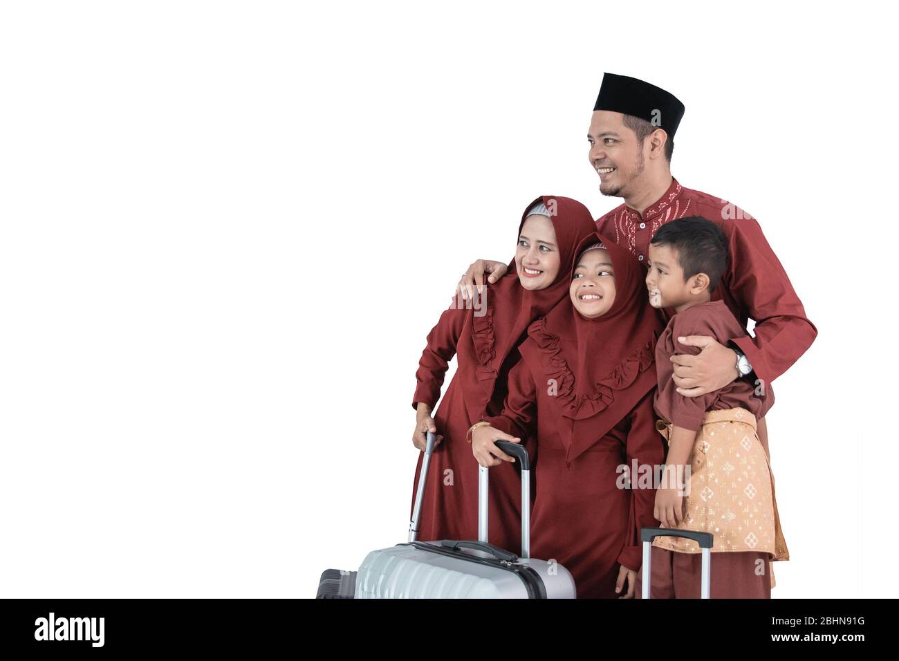 Asian Muslim family after packing clothes with suitcases to carrying ...