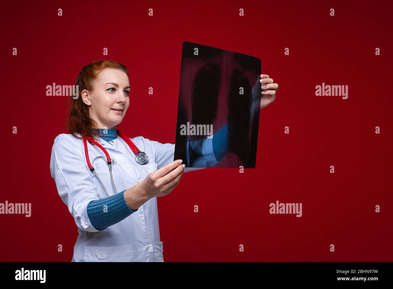 Physician happy with lung X-ray. Isolate on red background Stock Photo ...