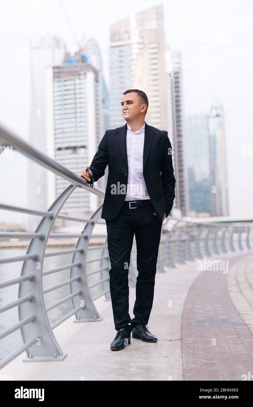 A handsome young business man at office building Stock Photo - Alamy