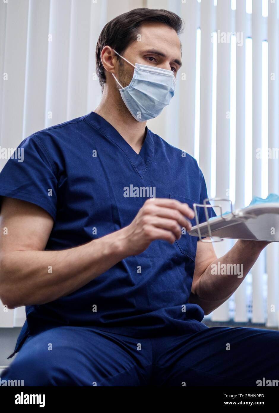 Doctor wearing protective mask in a hospital Stock Photo - Alamy