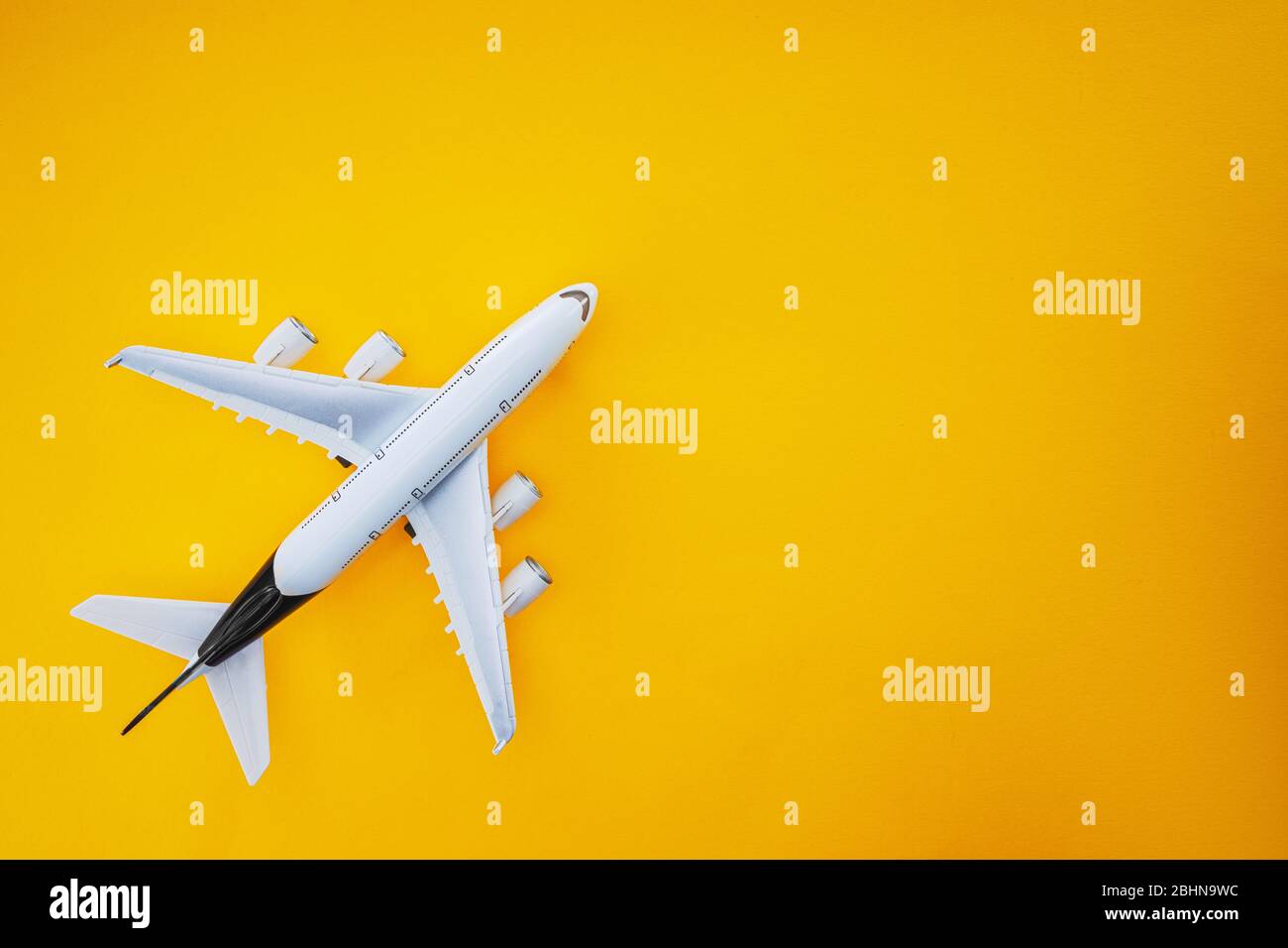 Sky airplane isolated on yellow background Stock Photo - Alamy