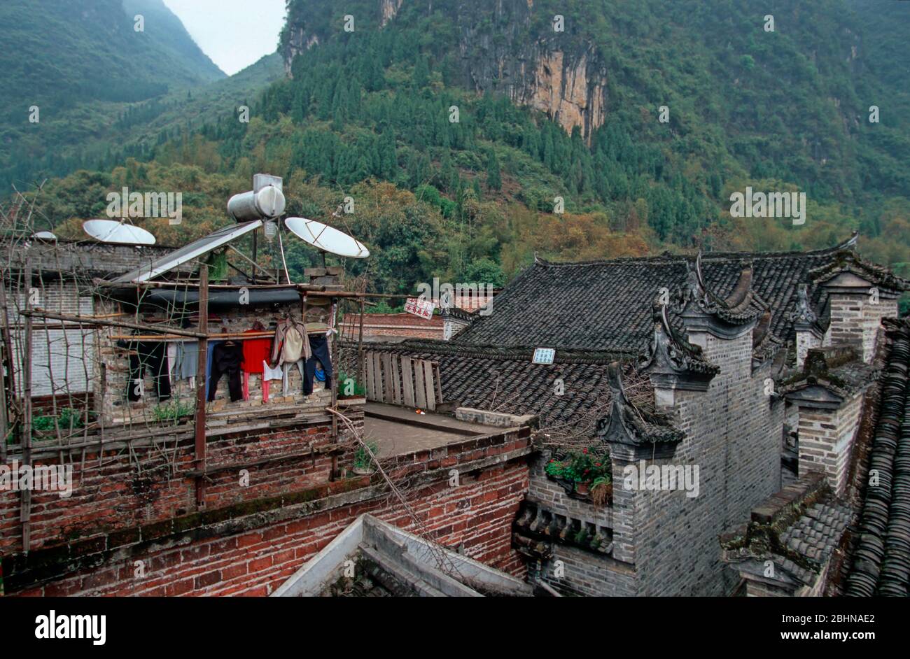 PARABOLIC ANTENNAS AND SOLAR PANEL ON THE ROOFS OF OLD FISHING VILLAGE ...