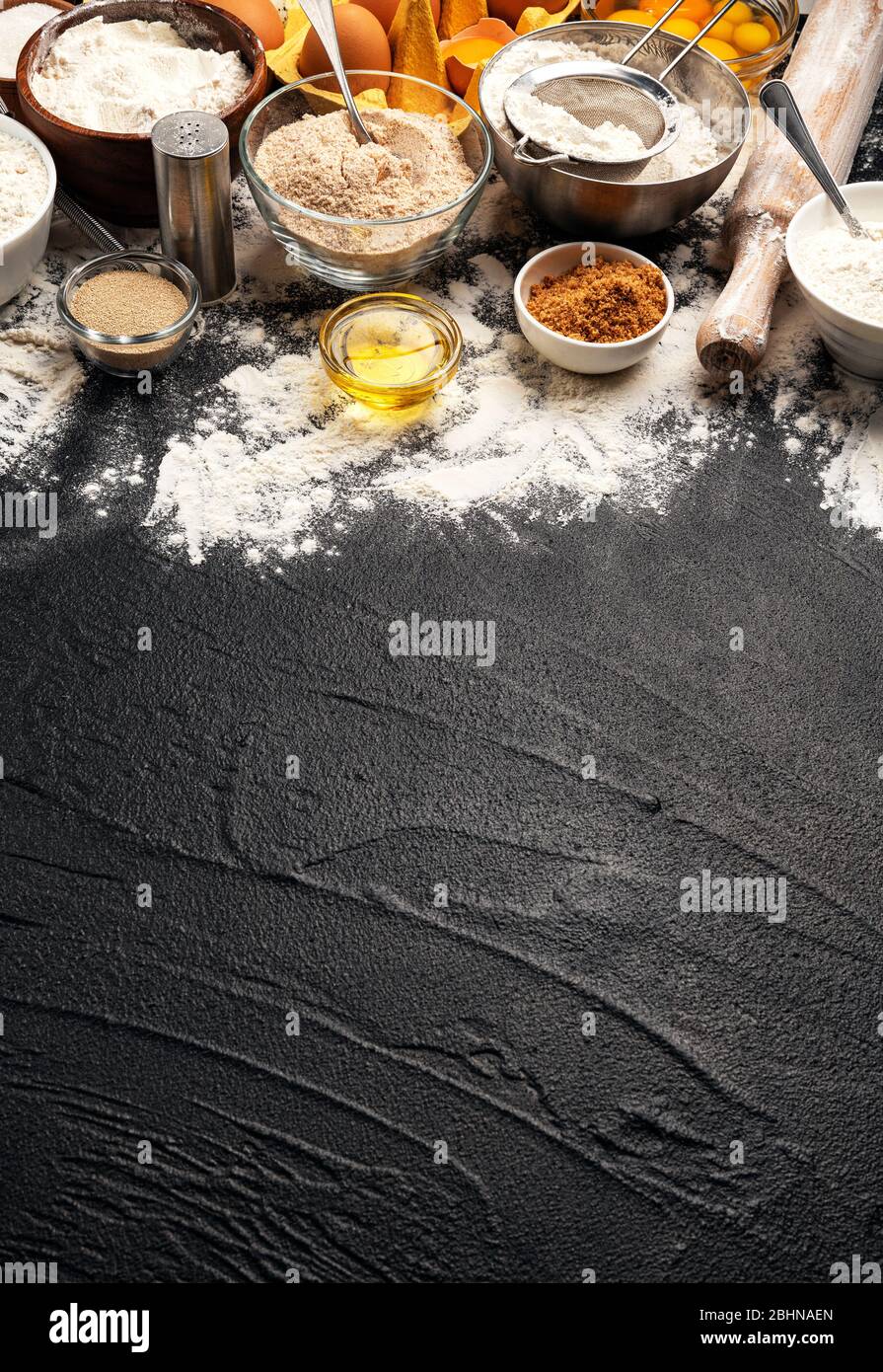 Baking ingredients on black background with copy space Stock Photo - Alamy