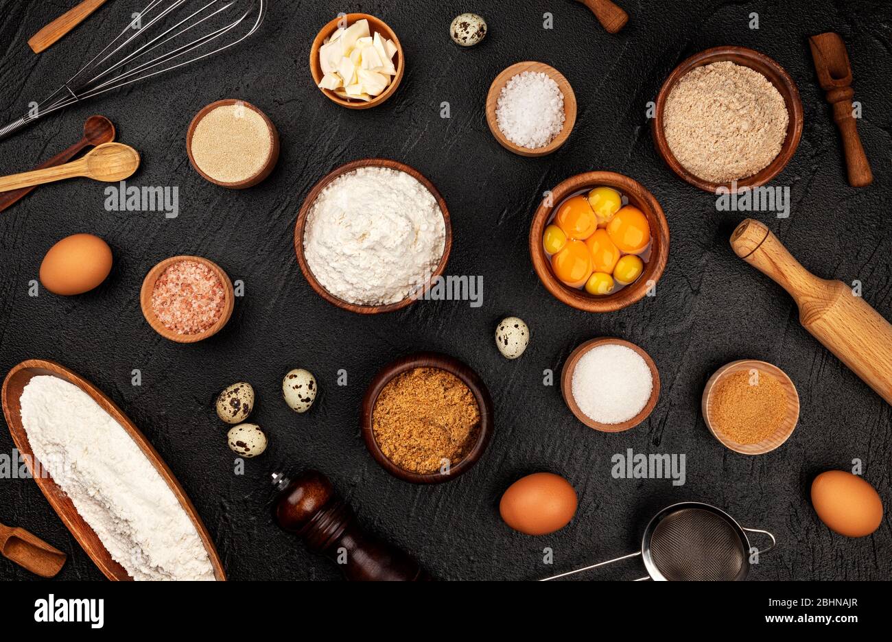 Baking ingredients pattern on black background, top view Stock Photo ...