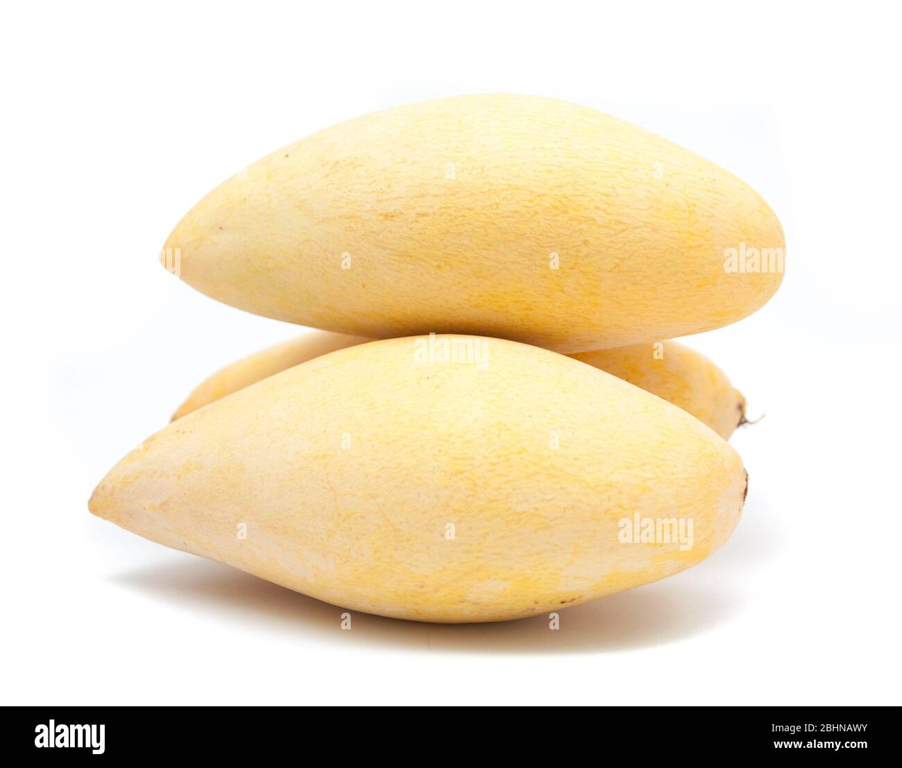 yellow three mango isolated on white background Stock Photo - Alamy