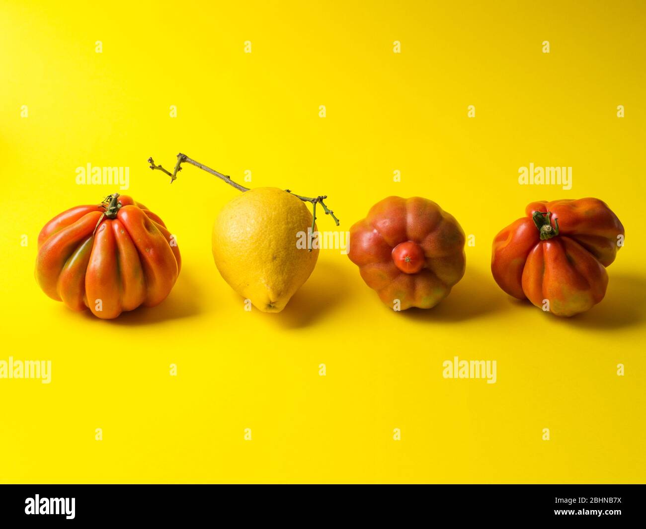 Ugly fruit and vegetables on yellow background Stock Photo - Alamy