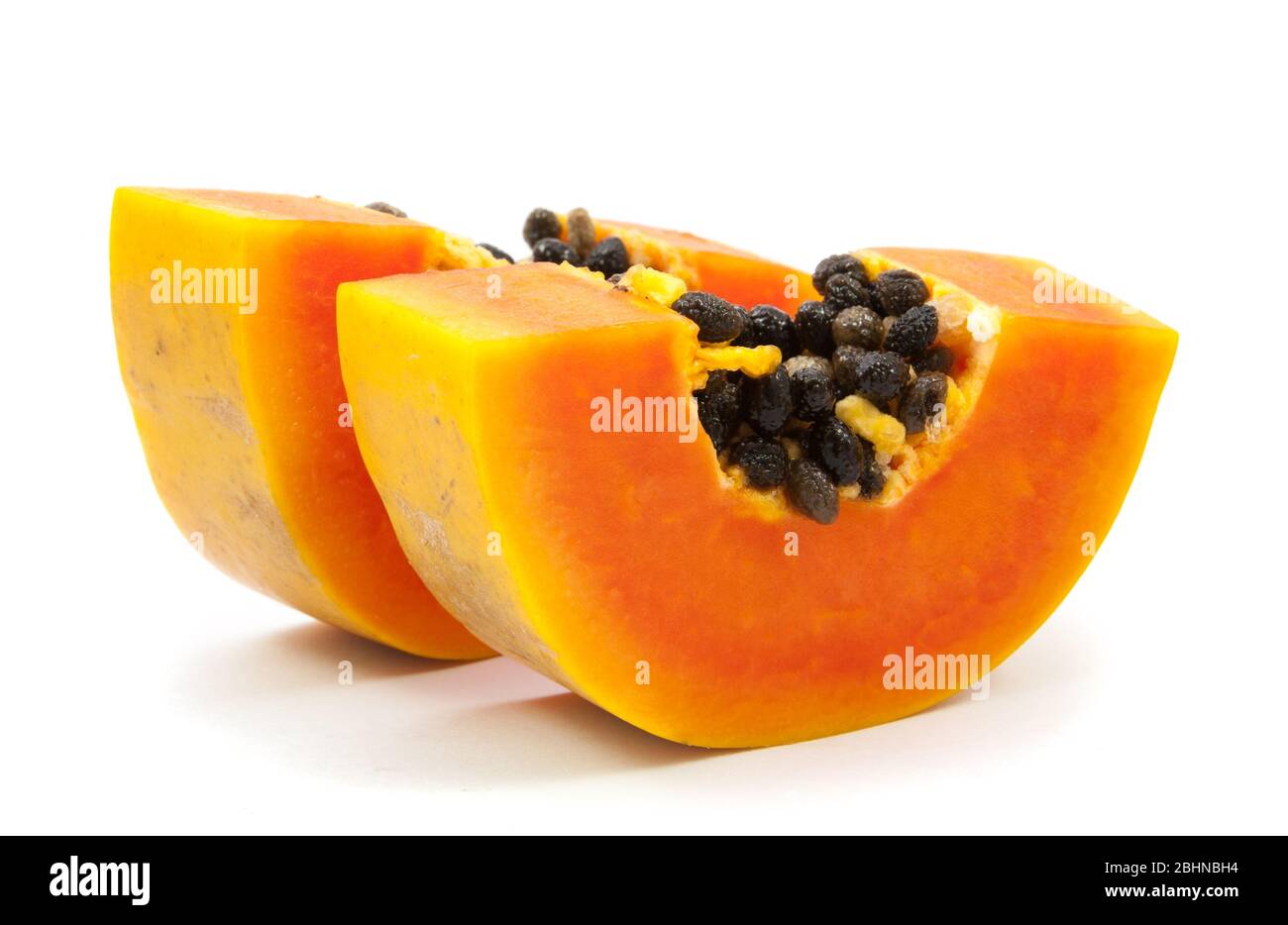slices of sweet papaya on white background Stock Photo - Alamy
