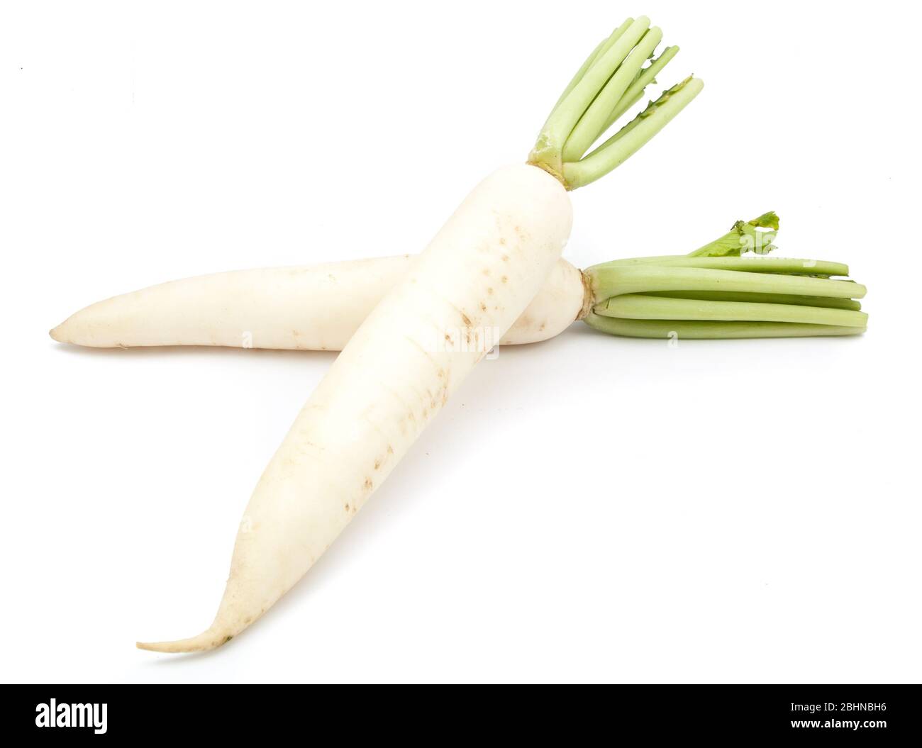 daikon radishes isolated on white background Stock Photo - Alamy