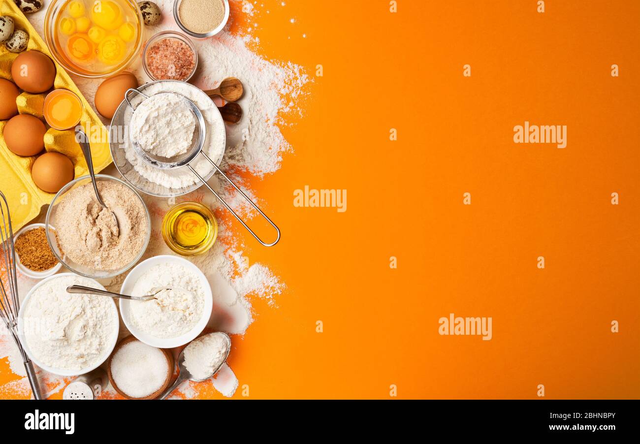 Baking ingredients on yellow color background, top view Stock Photo - Alamy