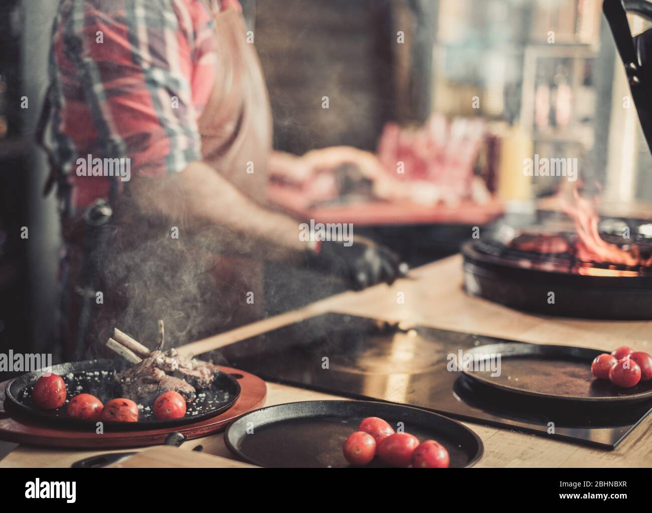 Chef serving freshly cooked meat in a restaurant Stock Photo - Alamy