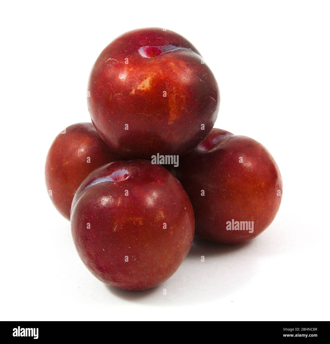 ripe purple cherry plums isolated on white Stock Photo - Alamy