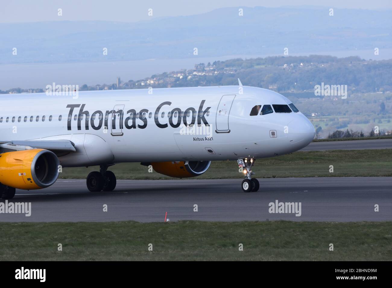 A Thomas Cook aeroplane on the runway at Bristol Airport, Lulsgate, UK ...