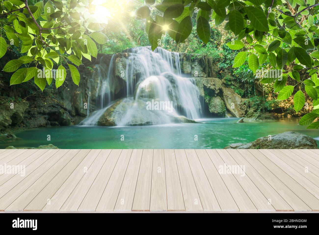 Waterfall with wood floor and sunshine Stock Photo - Alamy