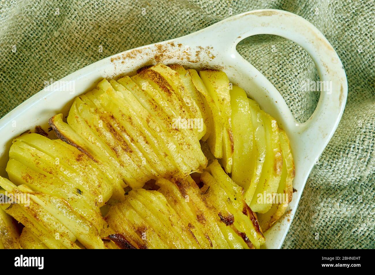 Crispy Leaf Potatoes -Best Roasted Potatoes Ever, sliced potatoes in a ...