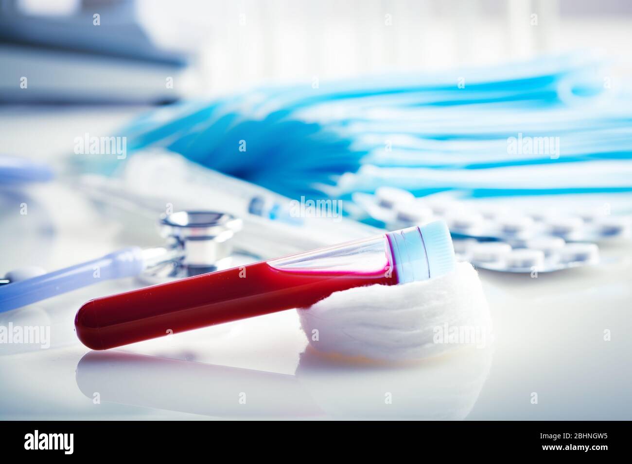 A test tube with a blood test in a medical laboratory. Background with ...