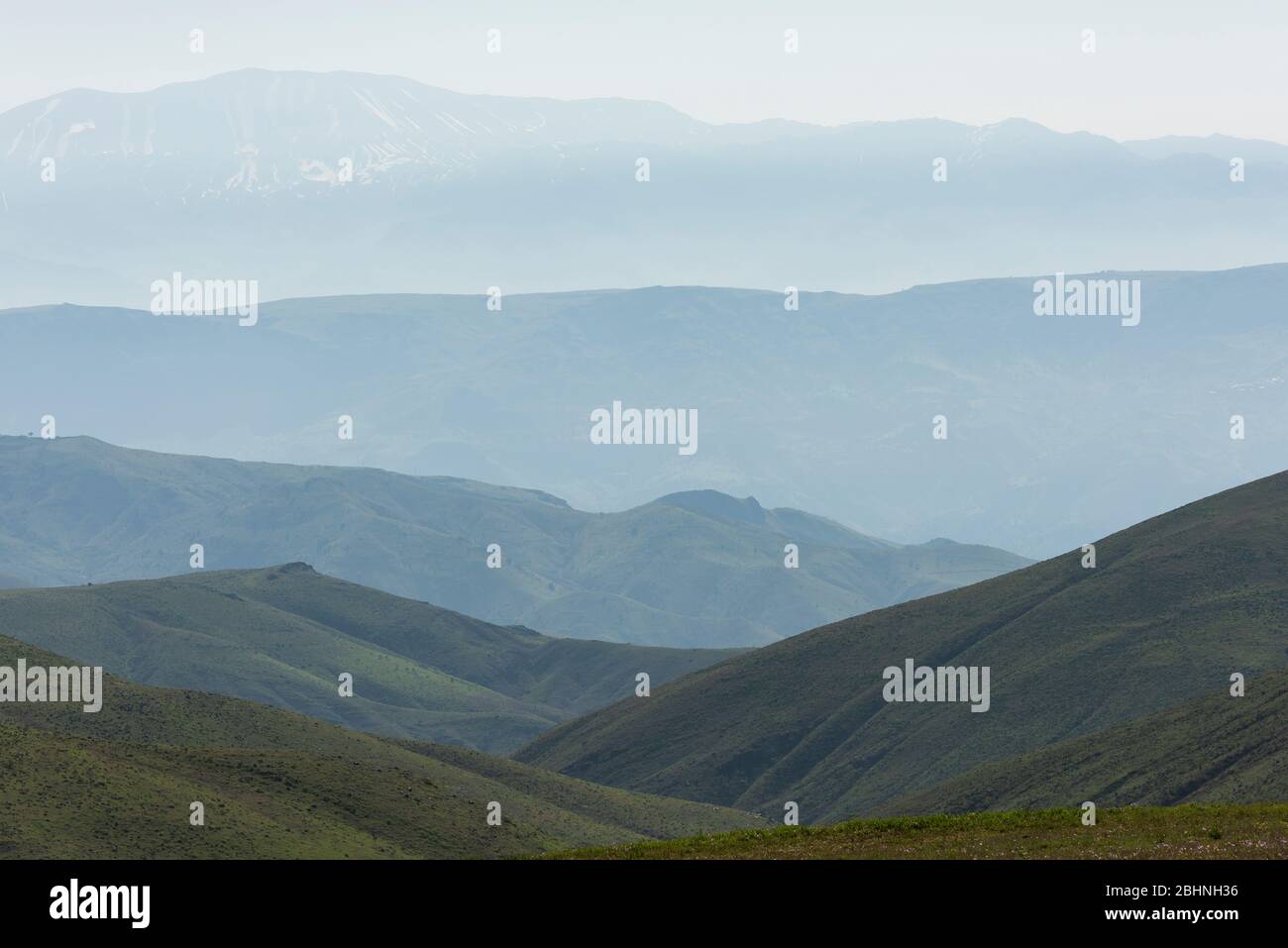 Green hills and mountains in Iran with fog and snow Stock Photo - Alamy