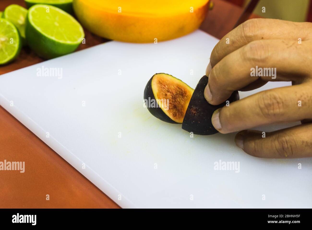 Hand slicing hi-res stock photography and images - Alamy