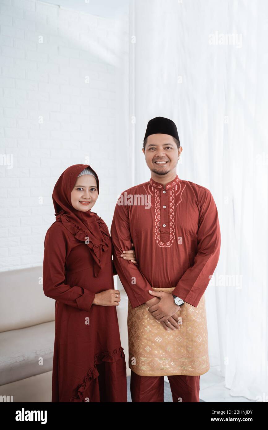 Muslim couples smile standing side by side in the room Stock Photo - Alamy