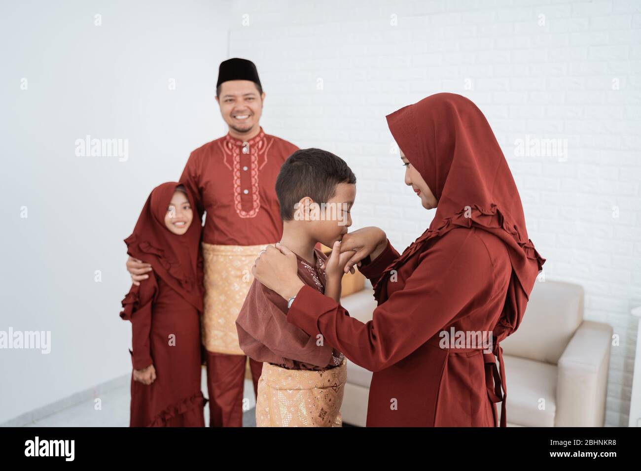 Muslim family members shaking hands to apologize and wish Ramadan ...