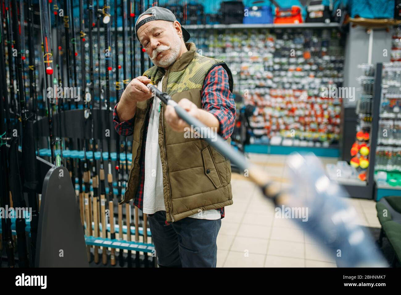 Male angler choosing rod hi-res stock photography and images - Alamy