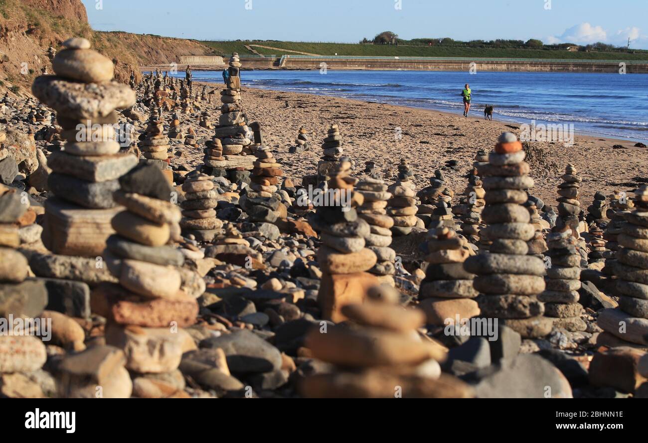 Pebble stacks on the beach at Whitley Bay, stretching for a quarter of ...