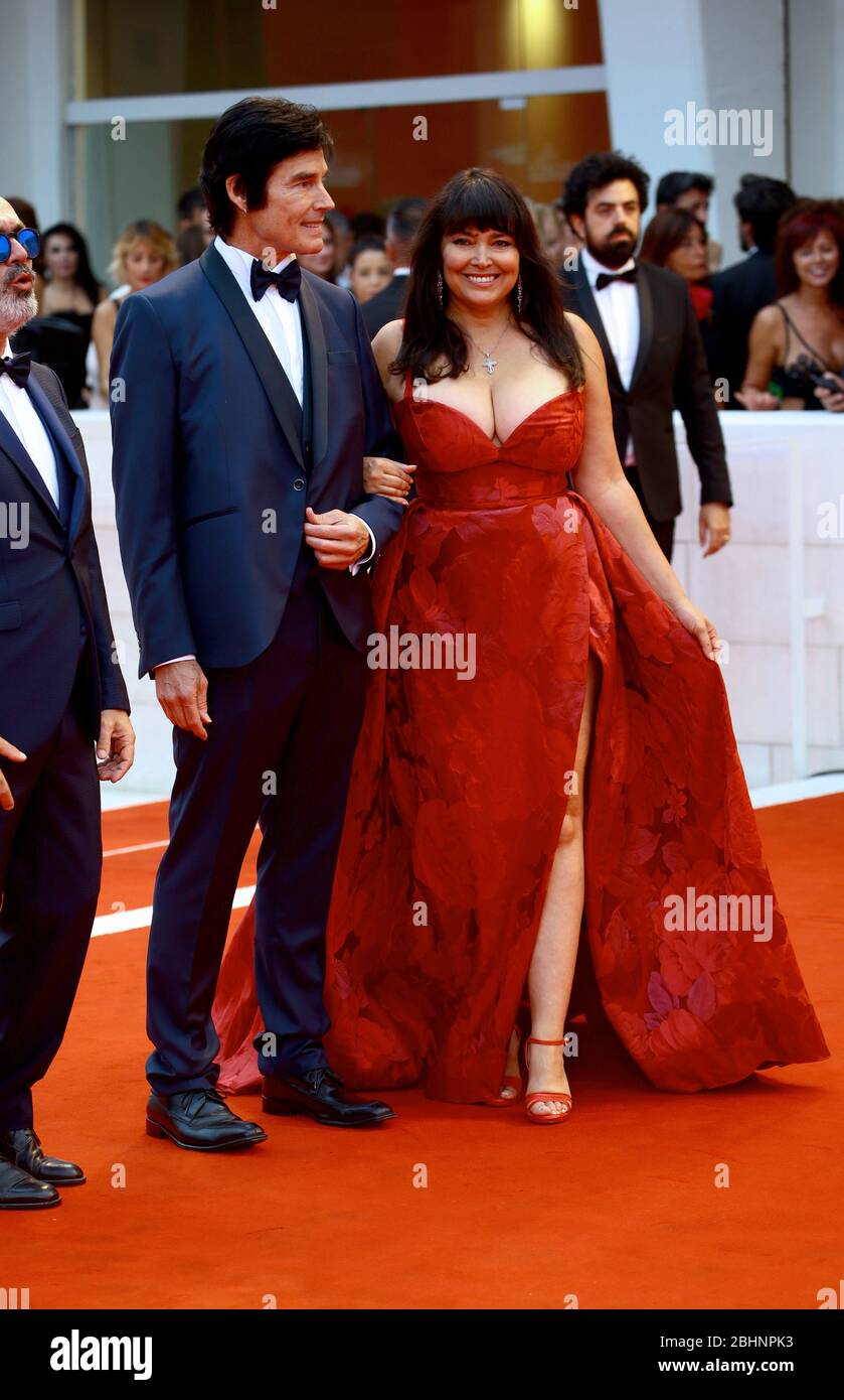 VENICE, ITALY - SEPTEMBER 07: Ronn Moss and Devin DeVasquez walks the ...