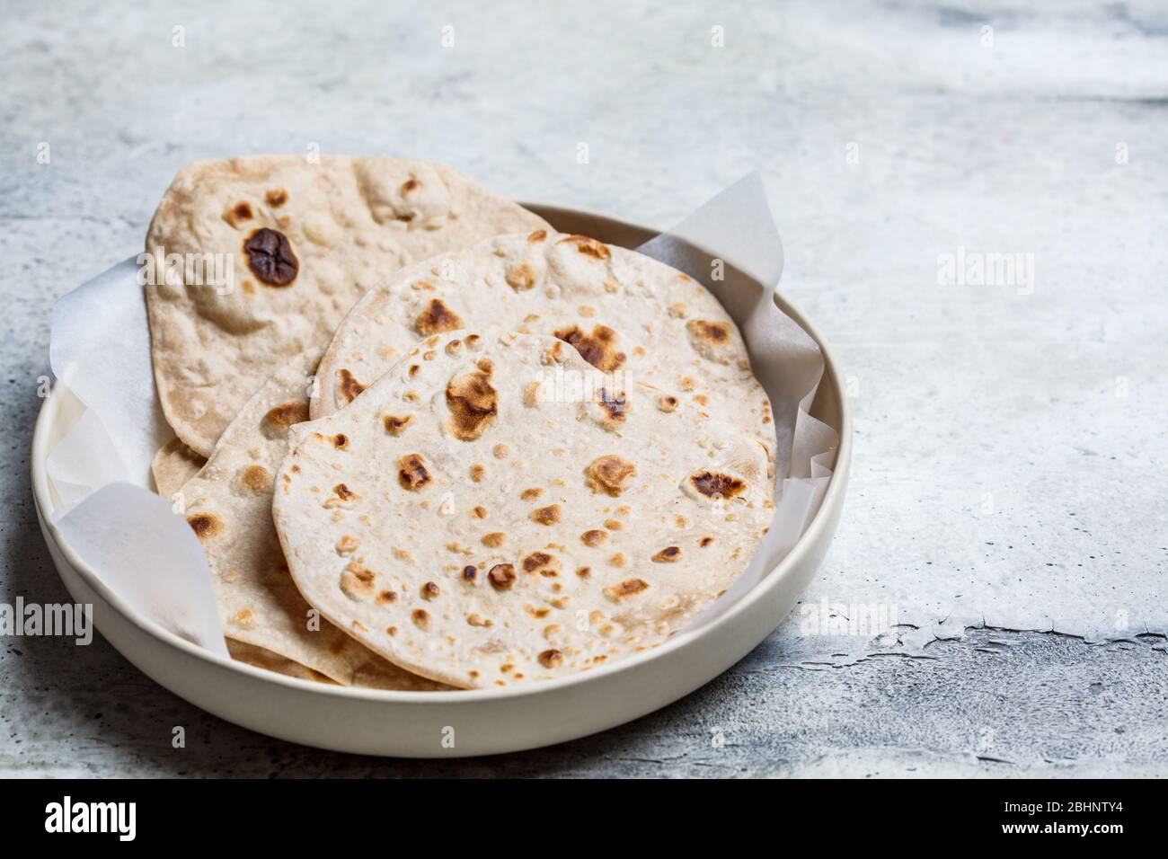 Homemade indian pita chapati on a gray background. Vegetarian cuisine ...