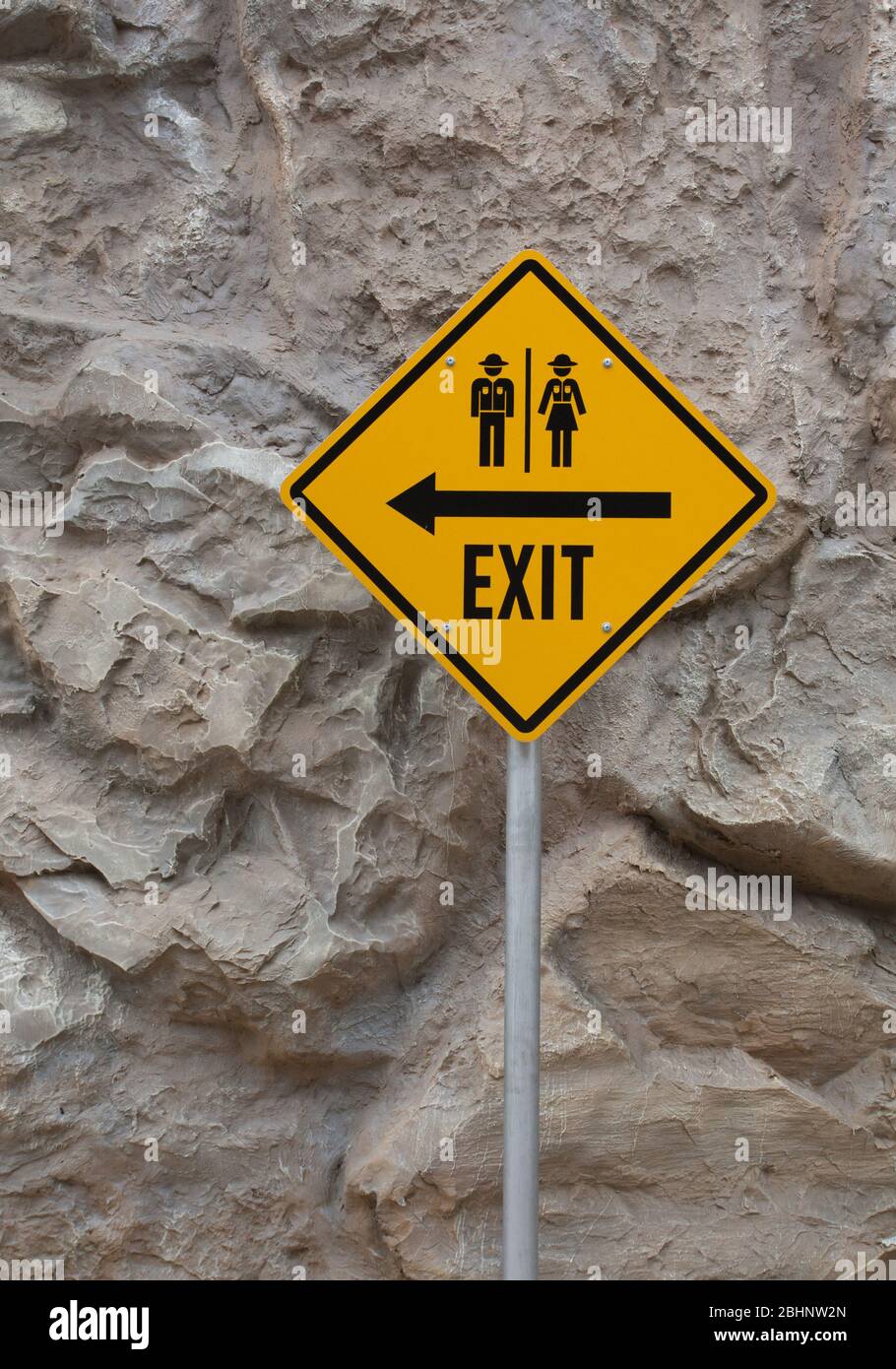 Tourist sign exit on yellow background Stock Photo - Alamy