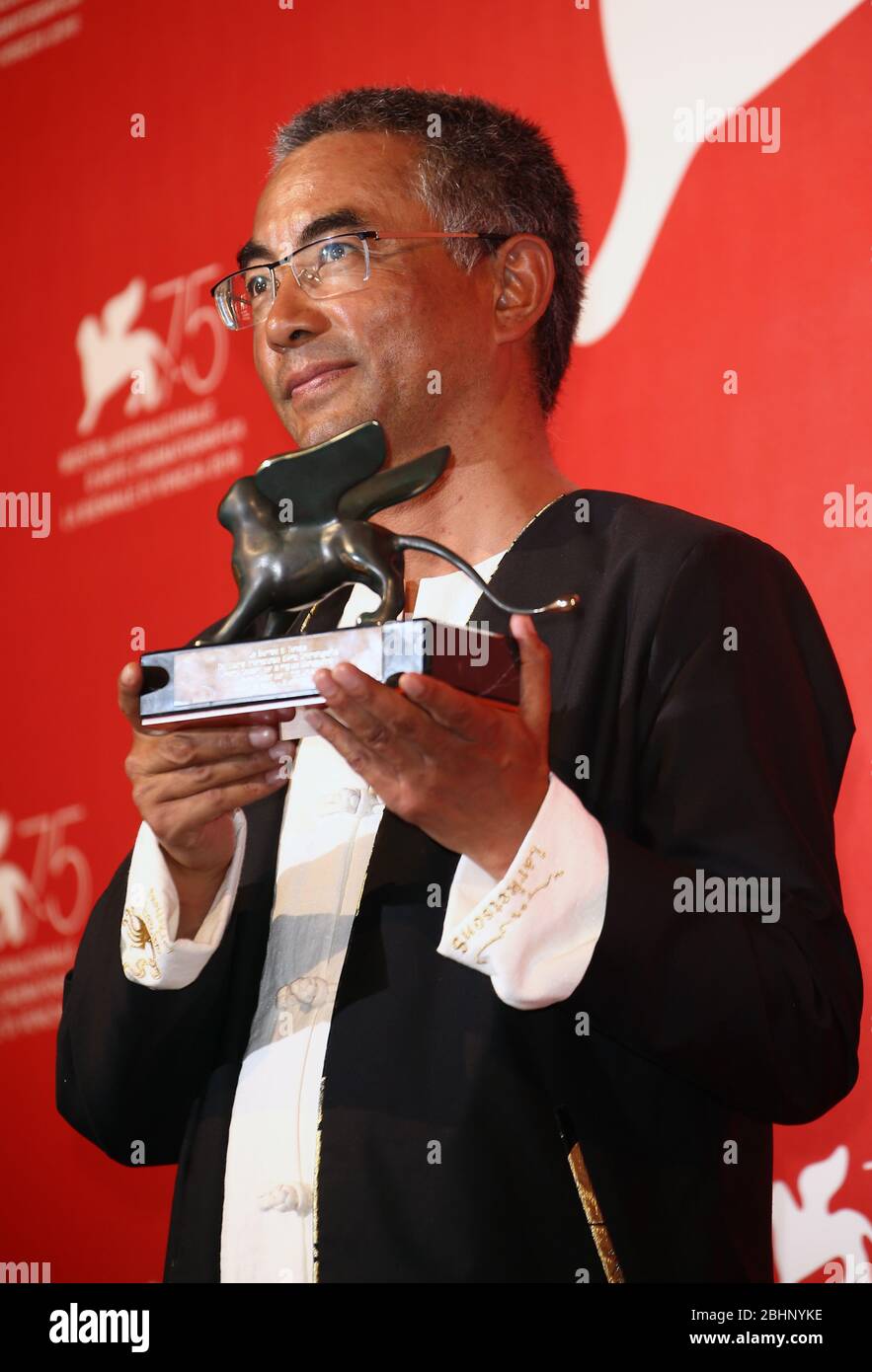 VENICE, ITALY - SEPTEMBER 08: Pema Tseden poses with the Orizzonti Award for 'Jinpa' at the ...