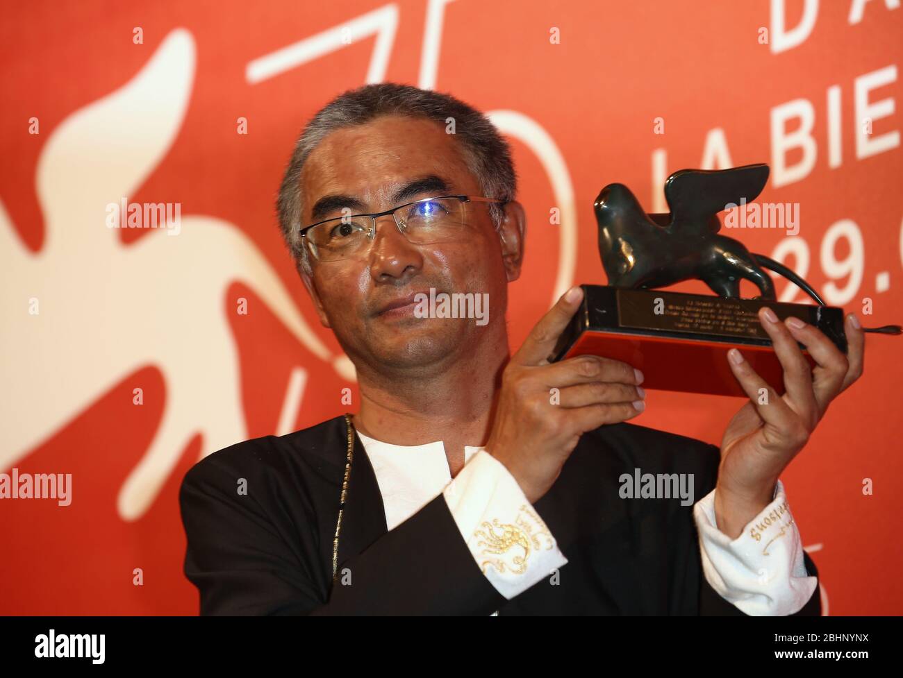 VENICE, ITALY - SEPTEMBER 08: Pema Tseden poses with the Orizzonti Award for 'Jinpa' at the ...
