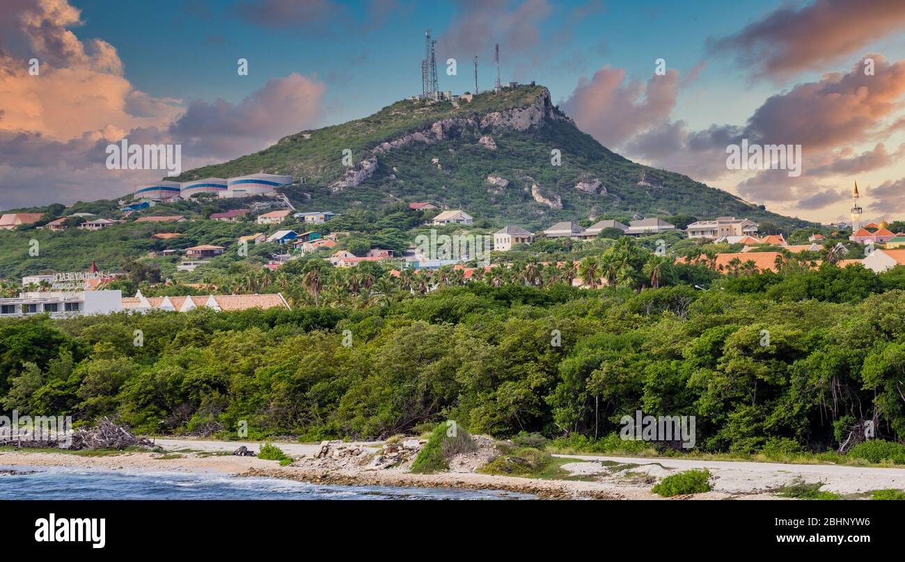Homes and Industry on Green Curacao Hill Stock Photo - Alamy