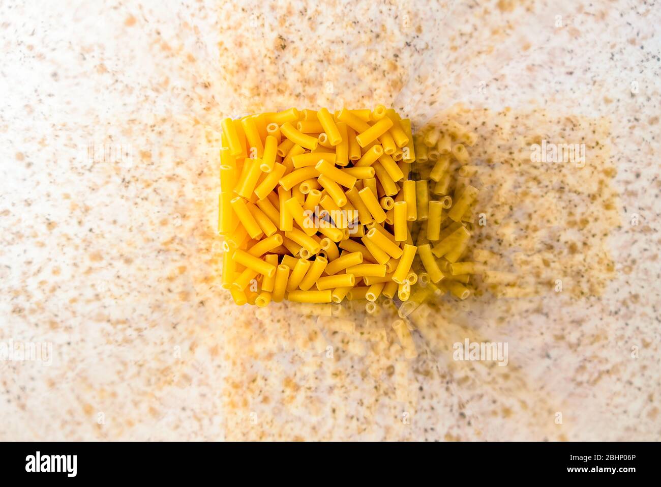 raw italian macaroni pasta inside clear storage container Stock Photo ...