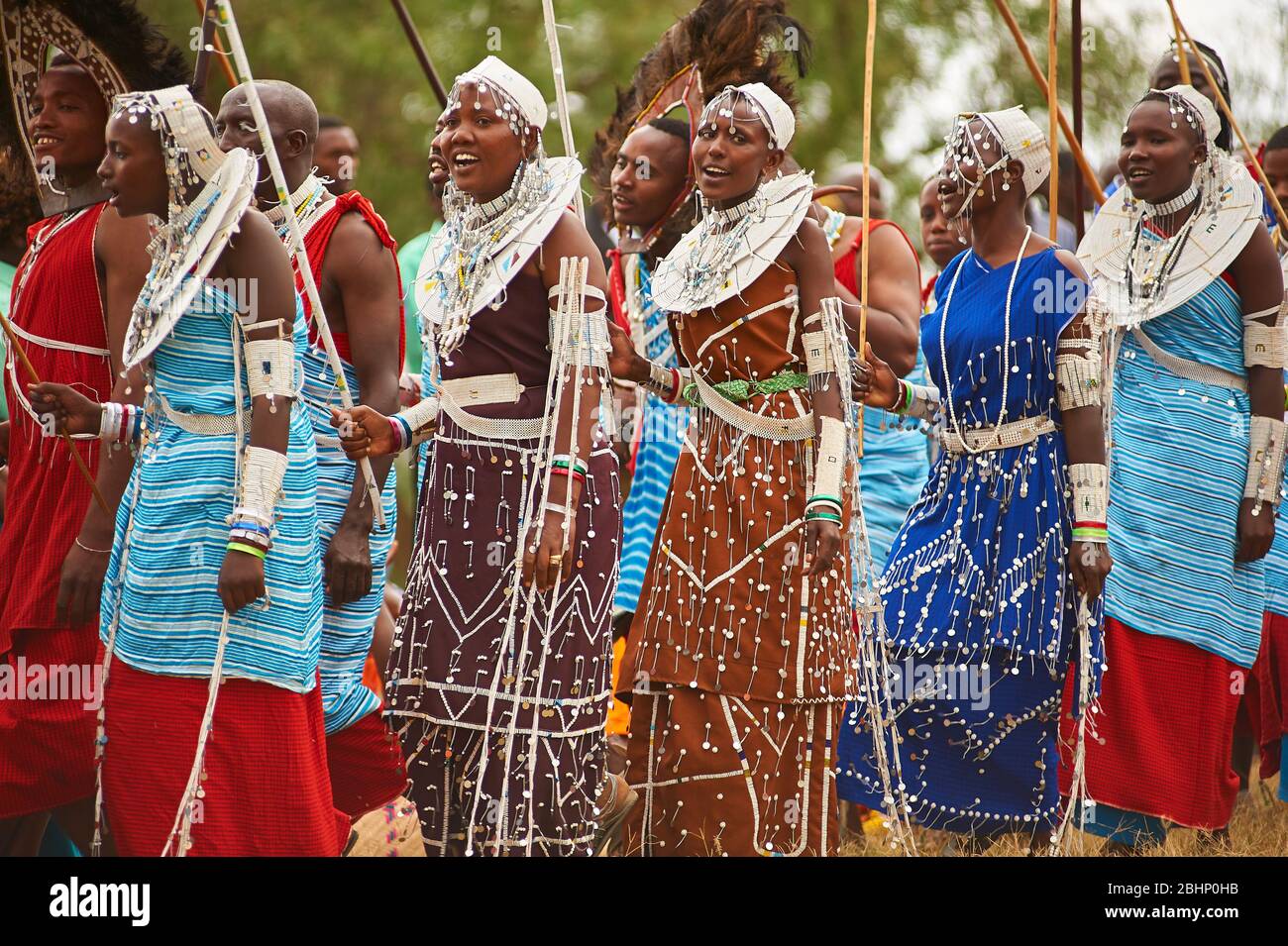 A Maasai choir dressed in traditional clothes and wearing their ...