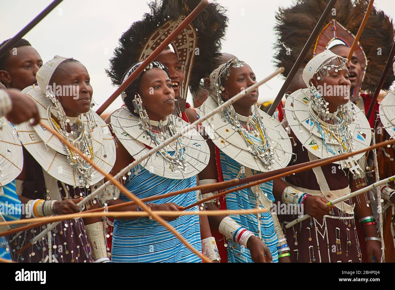 A Maasai choir dressed in traditional clothes and wearing their ...